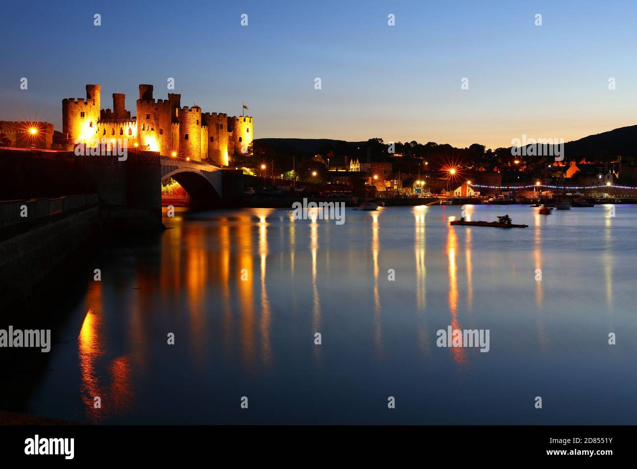 Conwy Castle floodlit against a blue Sky after Sunset, Conwy, North ...