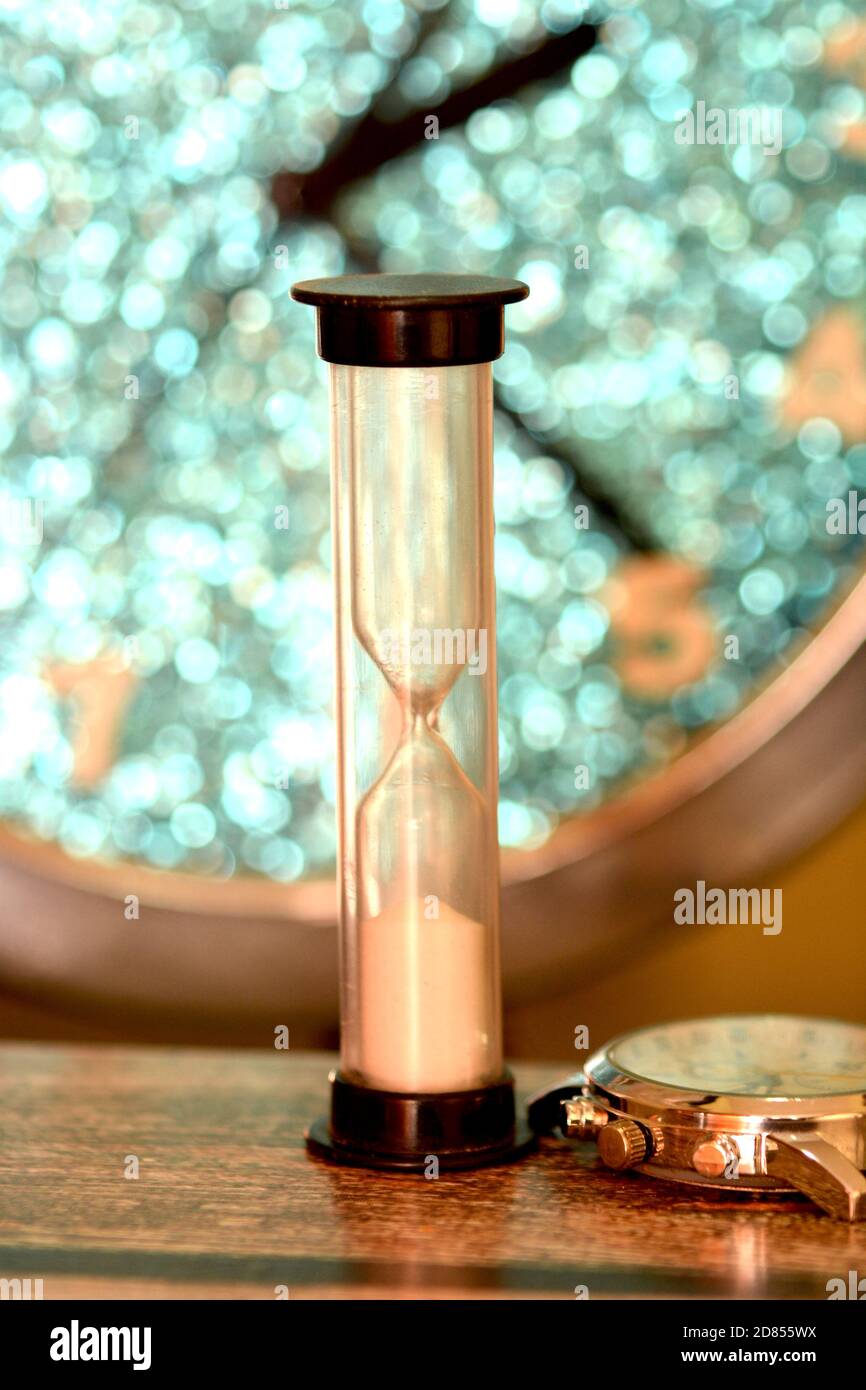hourglass watch time concept Stock Photo - Alamy