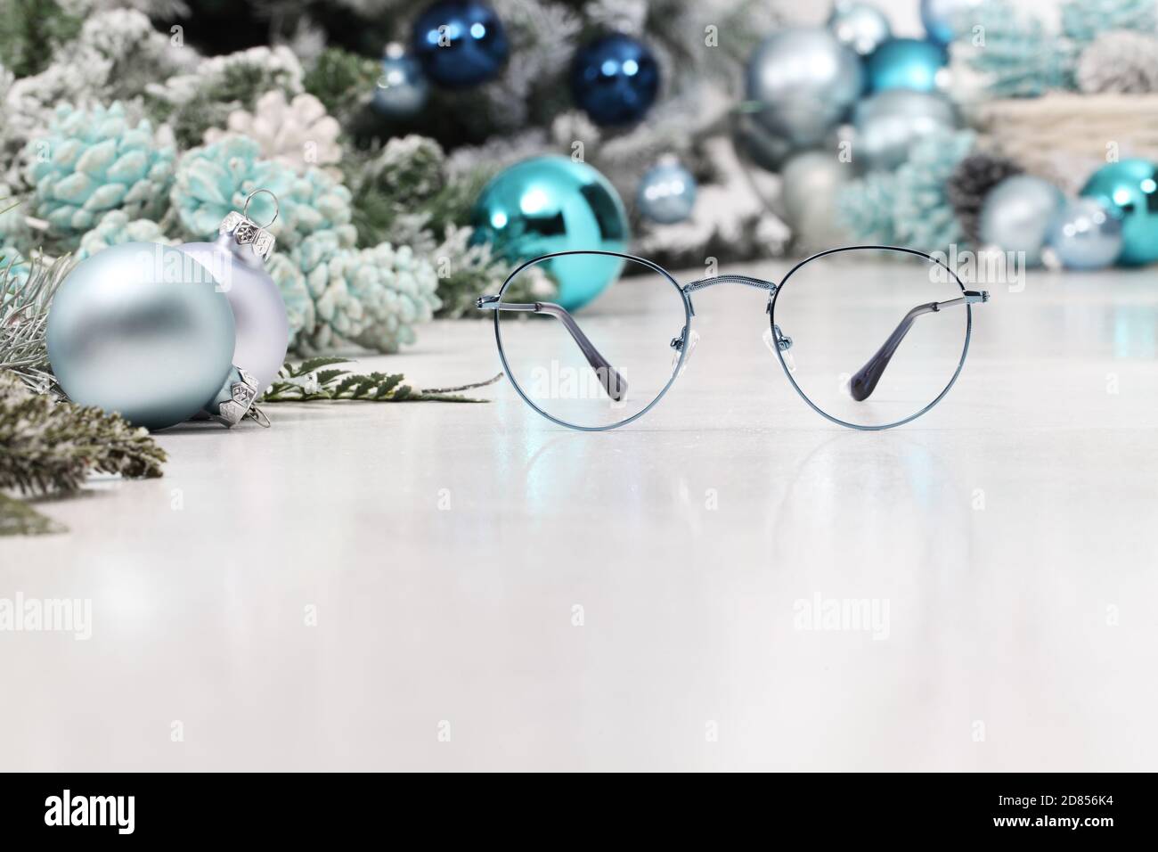 christmas eyeglasses blue spectacles isolated on white table with balls ...