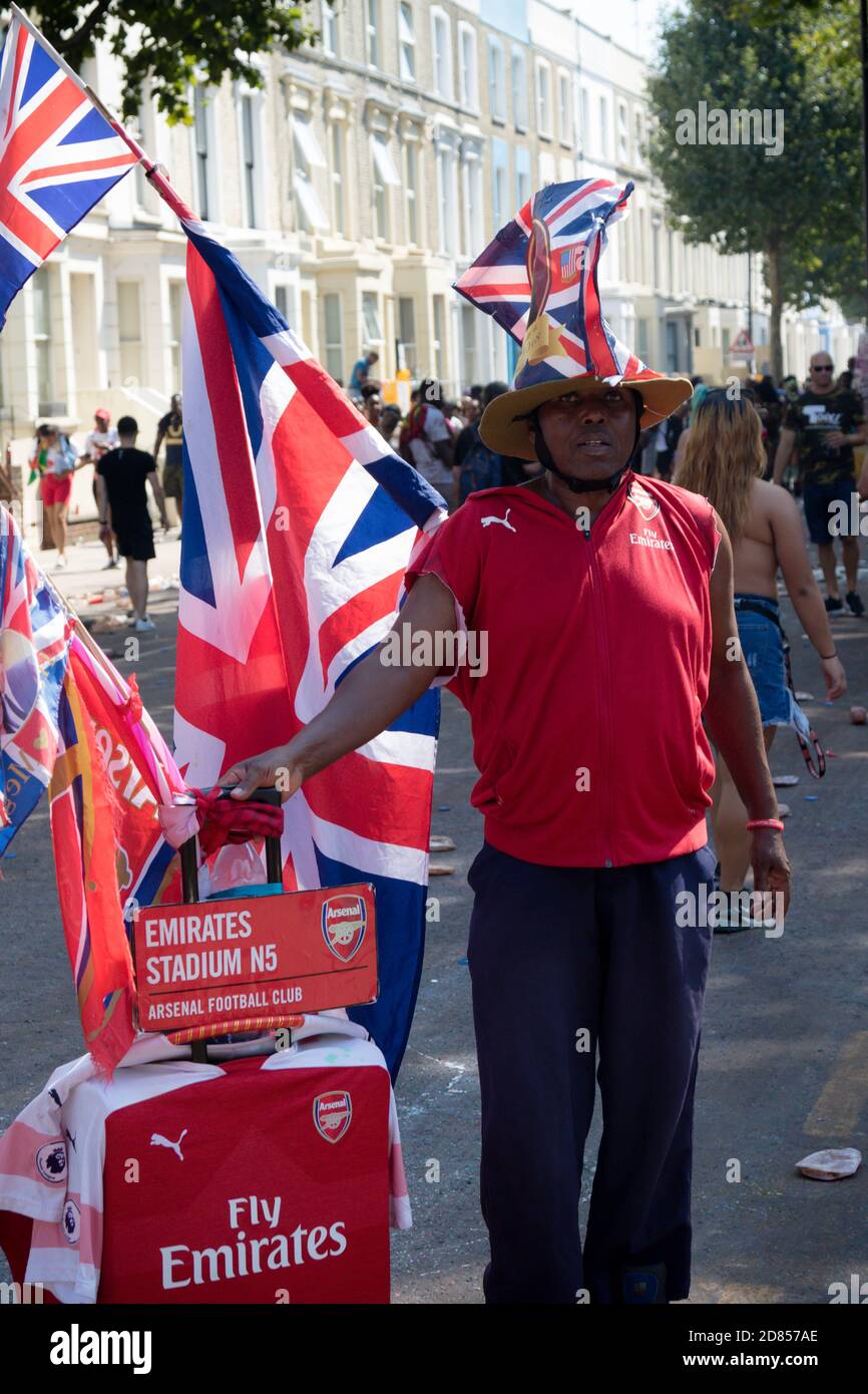 London, United Kingdom, August 25th 2019:- A man selling flags at the ...