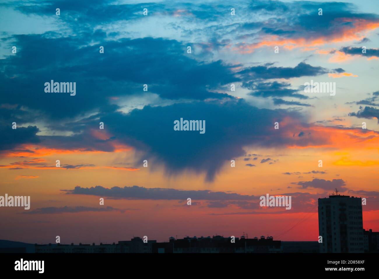 Dawn sky. Rain is gathering from the cloud. Red sky Stock Photo - Alamy