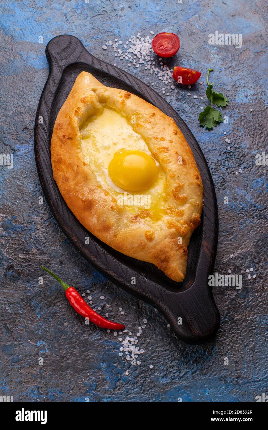 Khachapuri - traditional Georgian cheese and egg filled bread Stock ...
