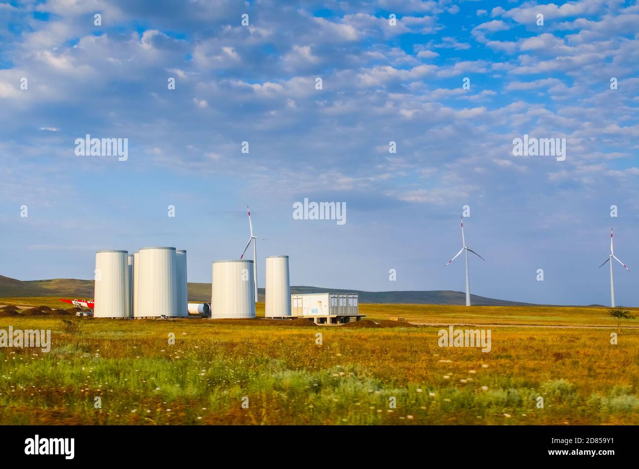 Windmill construction. Installation of a wind turbine. Blue sky Stock ...