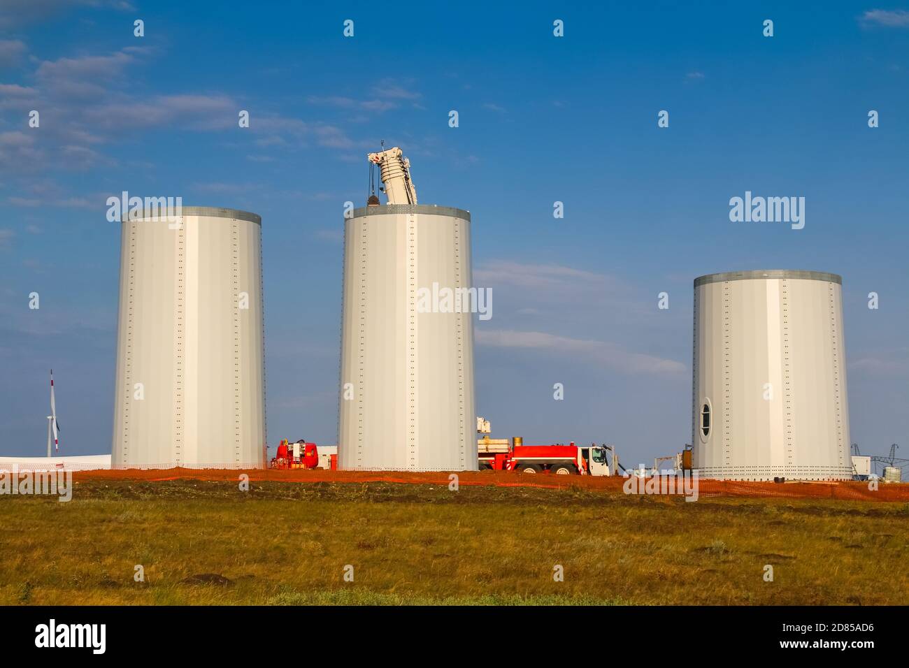 Windmill construction. Installation of a wind turbine. Blue sky Stock ...