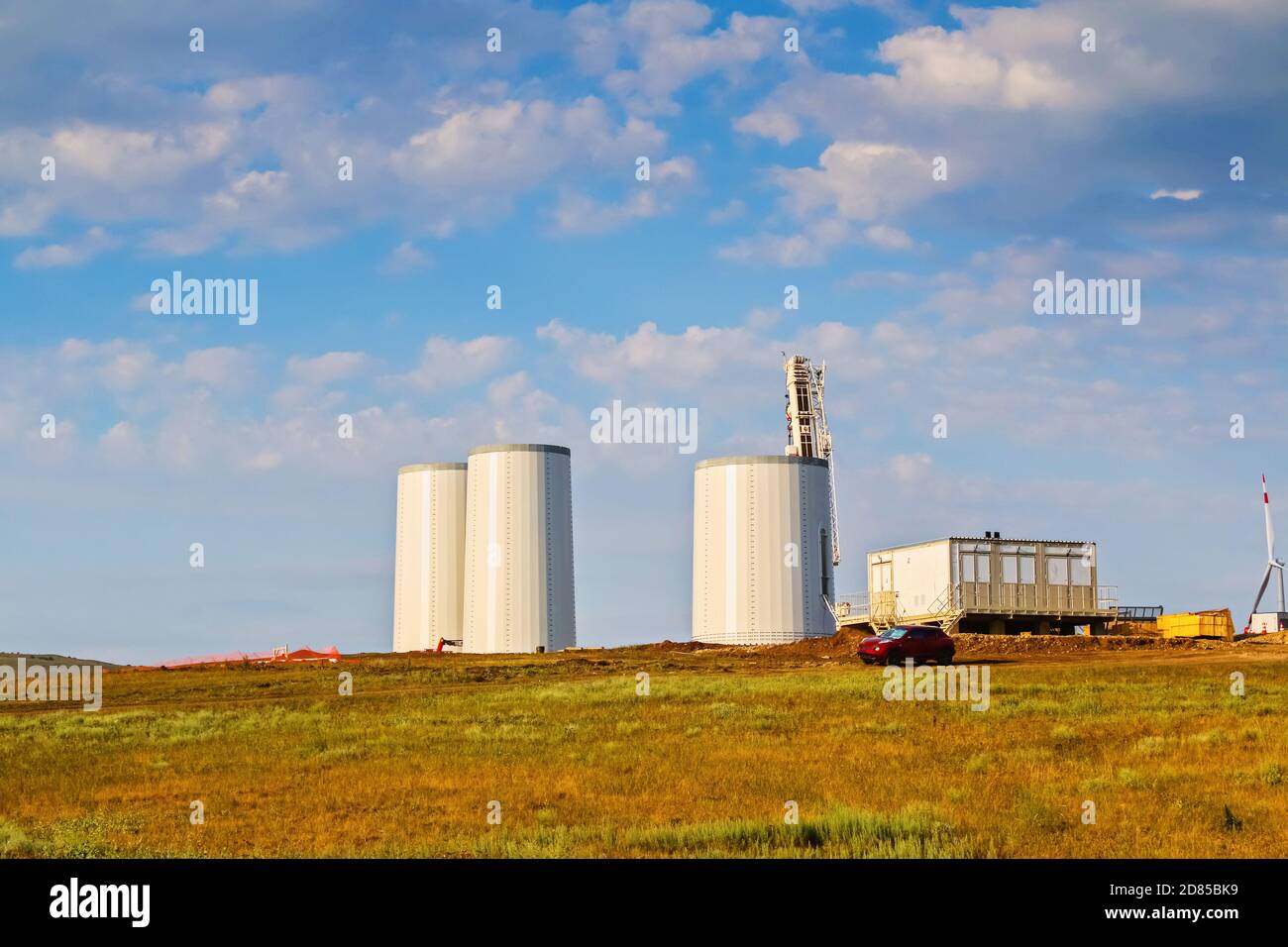 Windmill construction. Installation of a wind turbine. Blue sky Stock ...