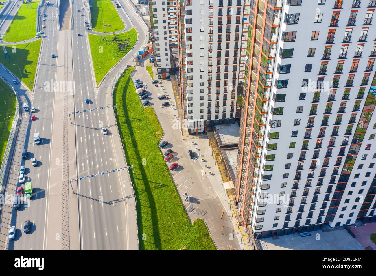 Urban highway car traffic with multi-storey buildings, aerial view ...