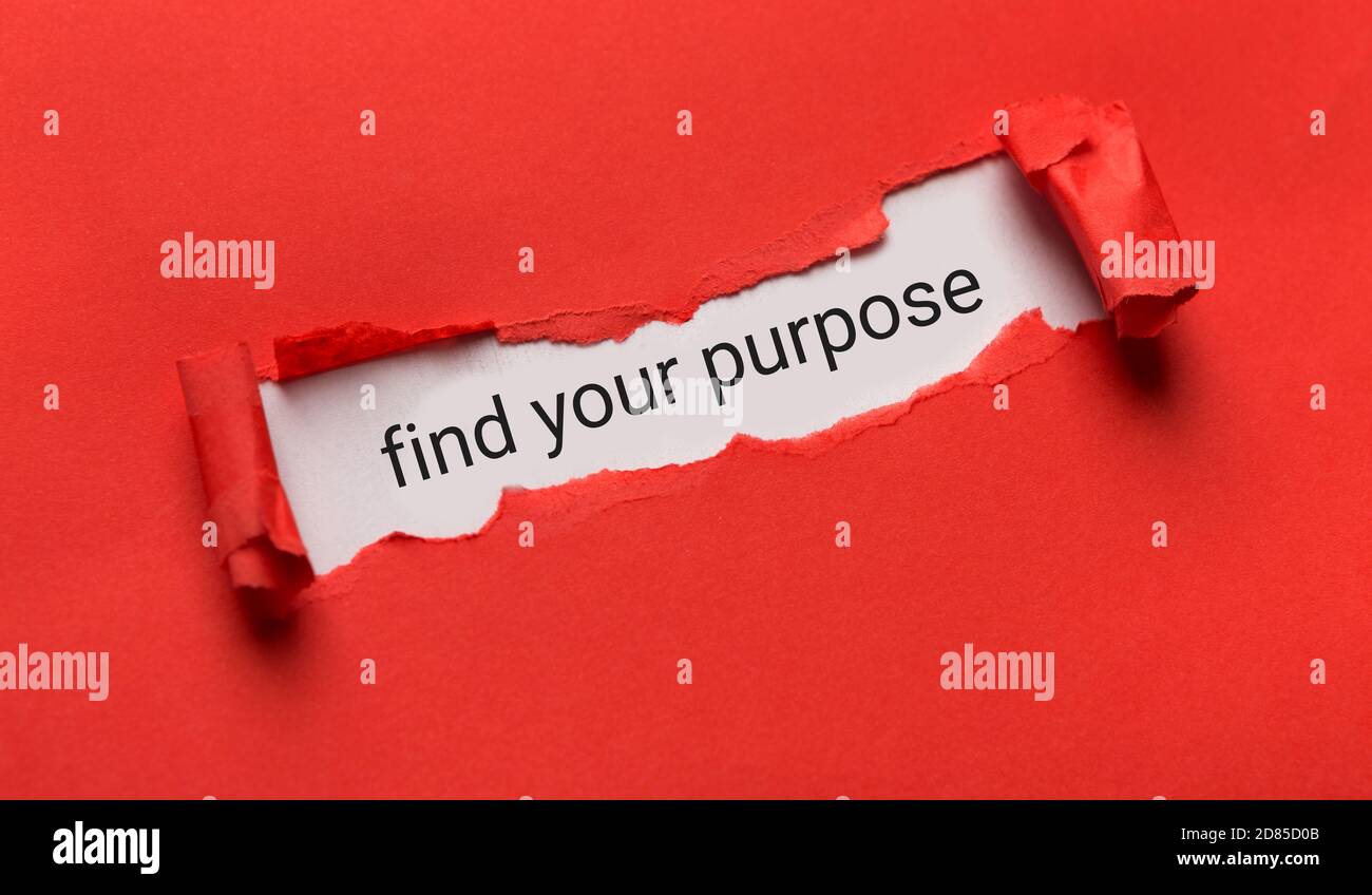 Find your purpose motivational inscription behind ripped red paper ...