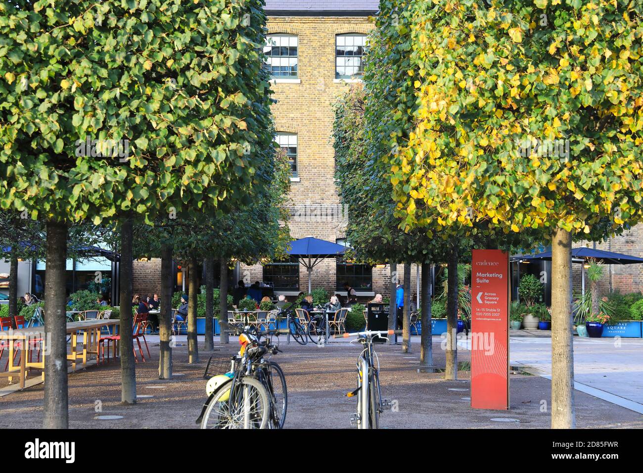Granary Square at Kings Cross in autumn sunshine, in north London, UK ...