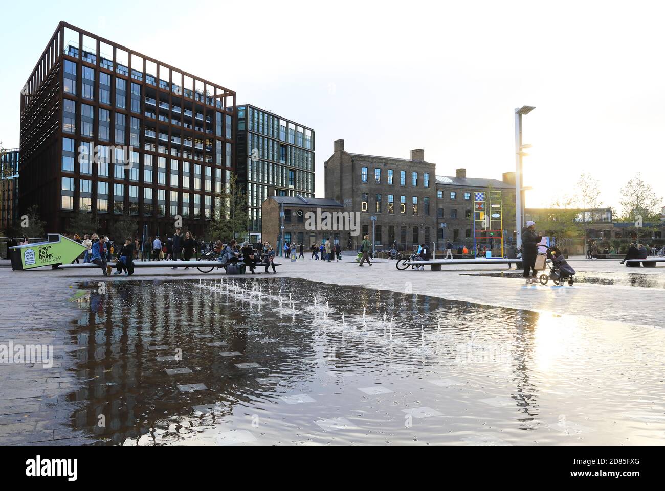 Granary Square at Kings Cross in autumn sunshine, in north London, UK ...