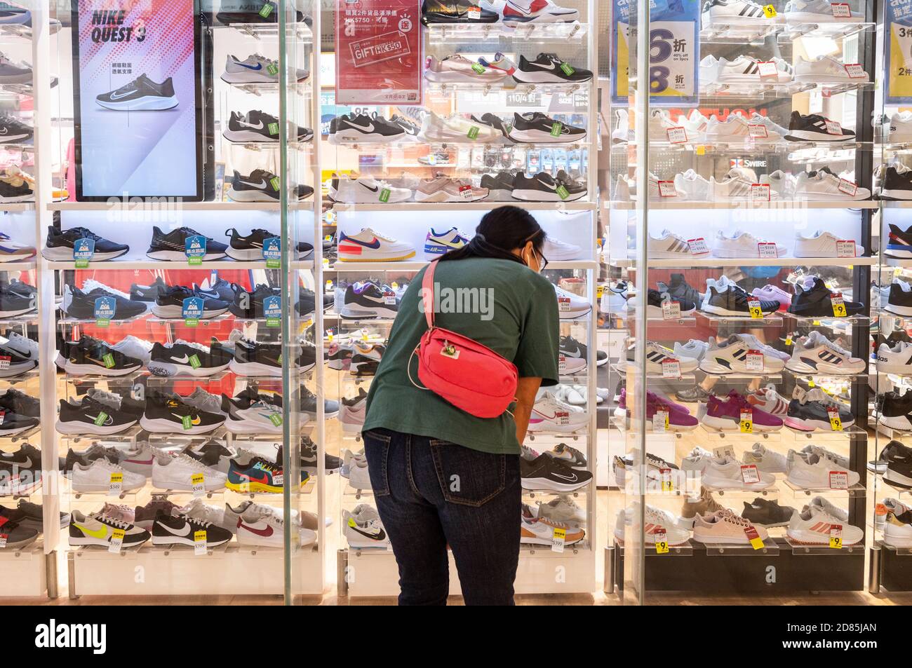 A woman window shopping at a shoe footwear store in Hong Kong Stock ...