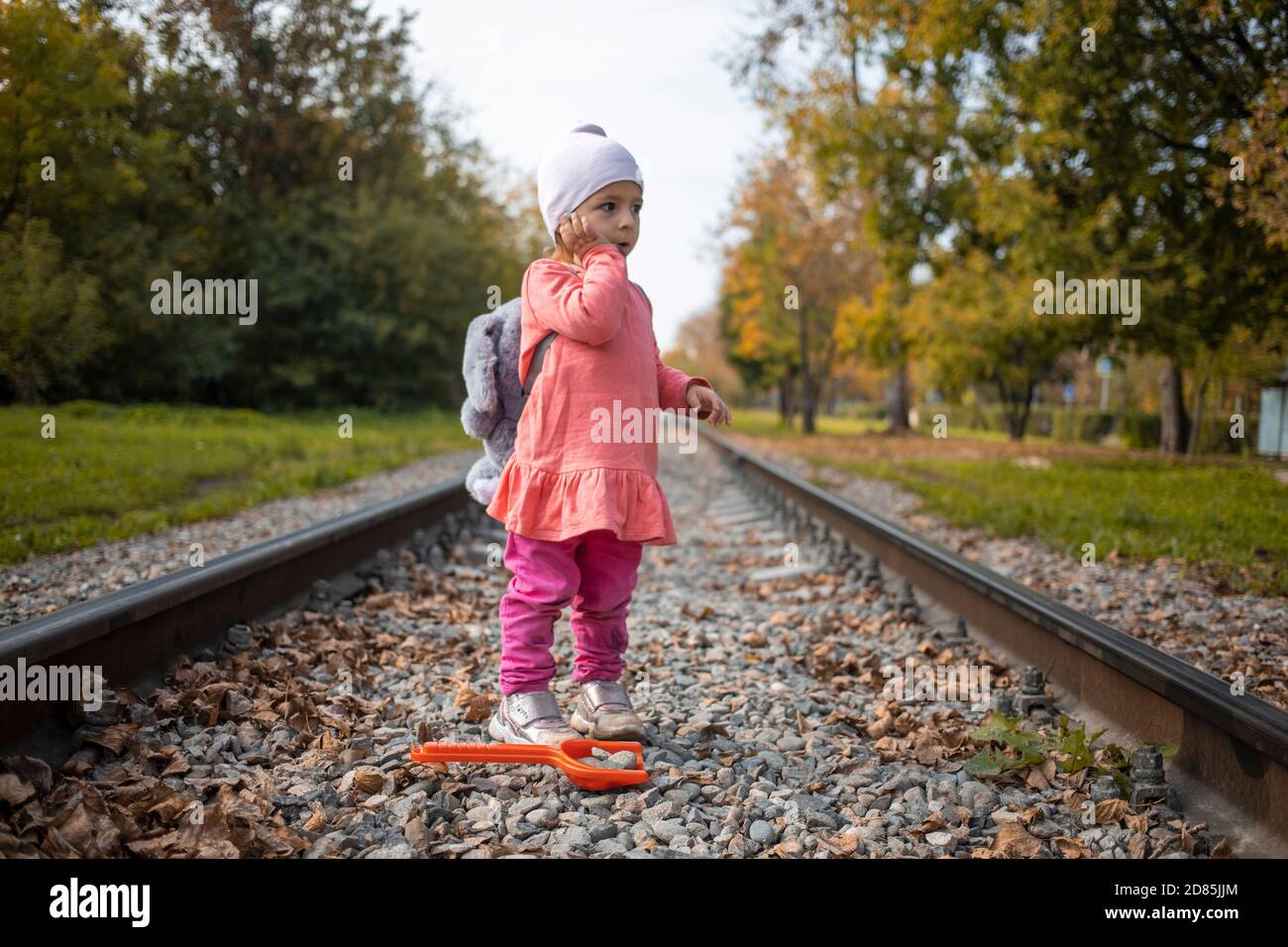 scared lonely child lost on railroad track Stock Photo - Alamy