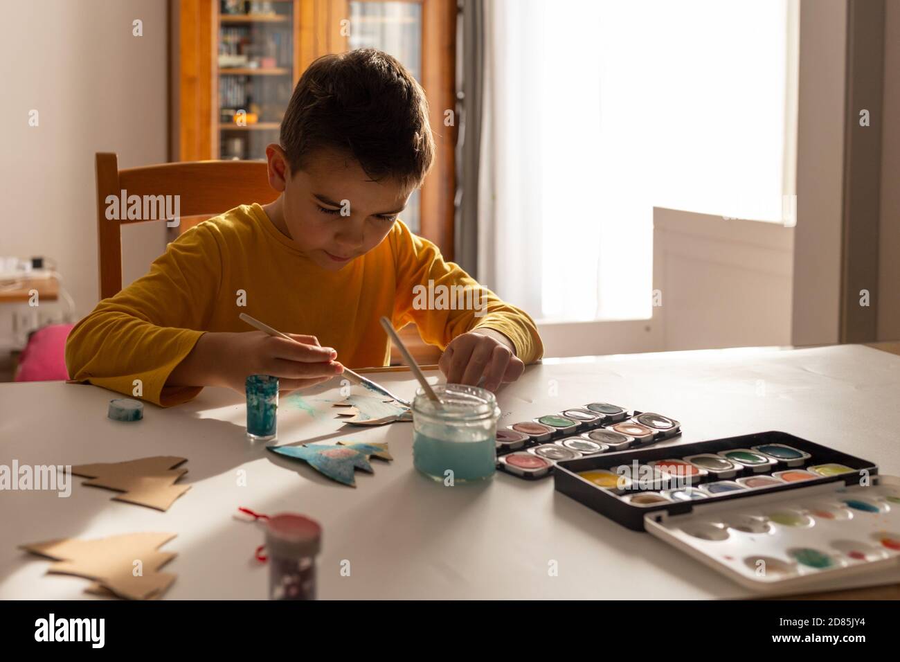 boy doing homework, preschool kid drawing at home, occupation and ...