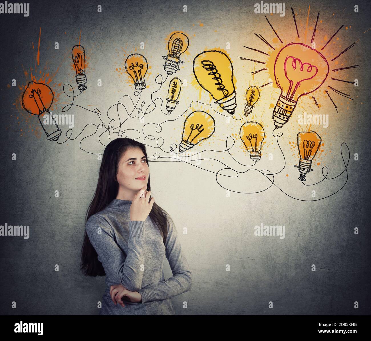 Creative young woman thinking of great ideas, looking at bright ...