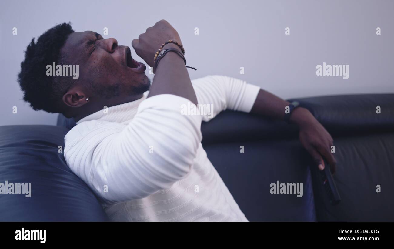 Anxious black man yawning hi-res stock photography and images - Alamy
