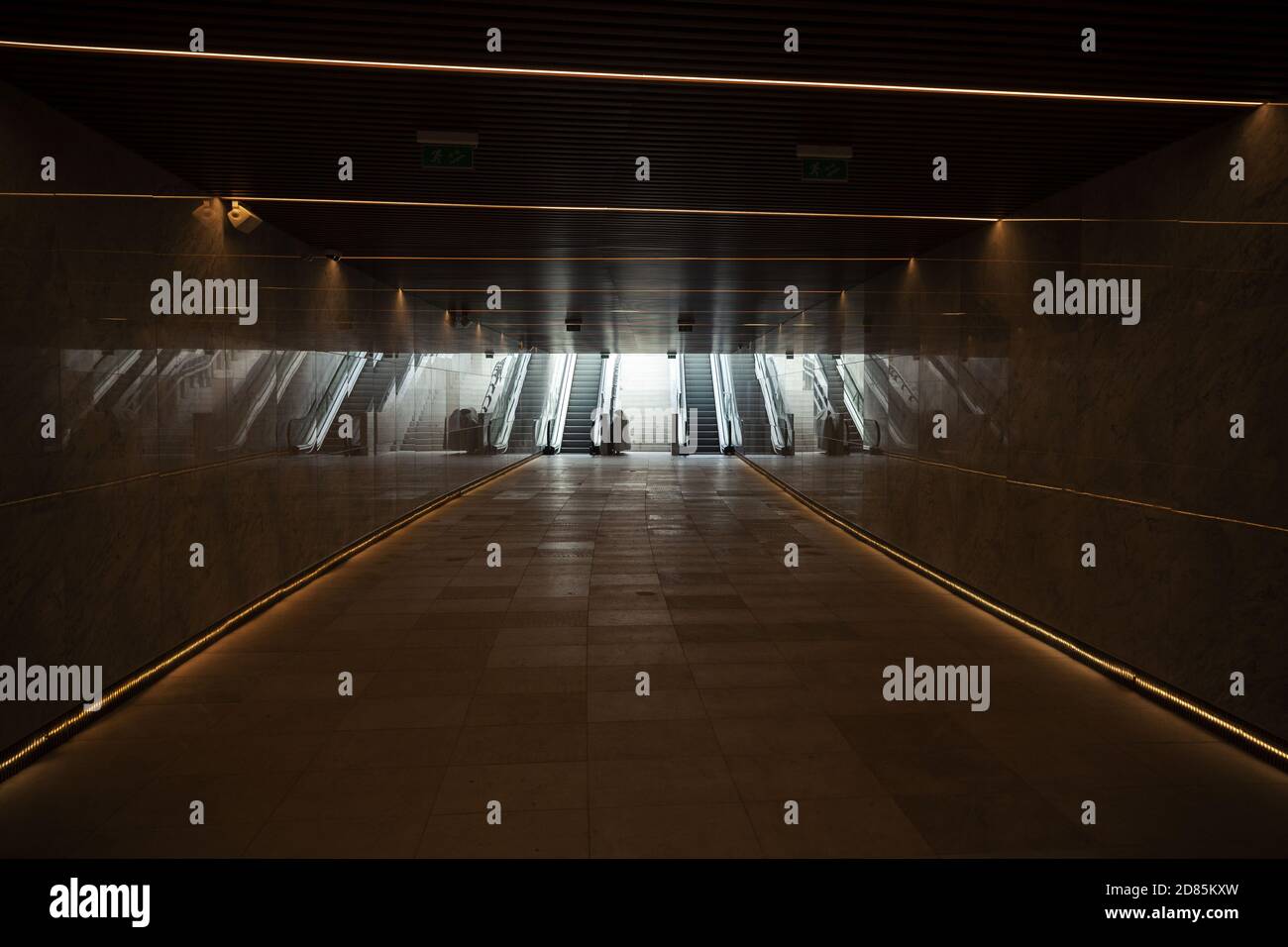 large empty underground passage with escalators Stock Photo - Alamy