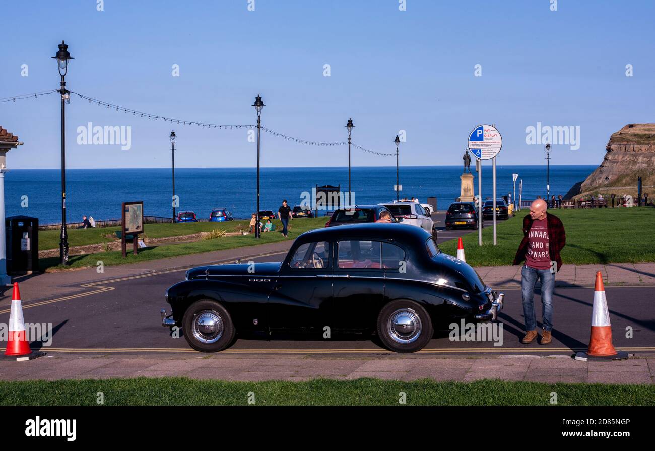 Man looking at vintage car, Whitby, England, UK Stock Photo - Alamy