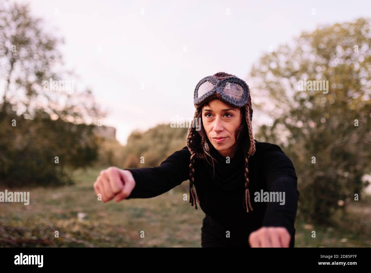 Woman fooling around on a park bench Stock Photo - Alamy