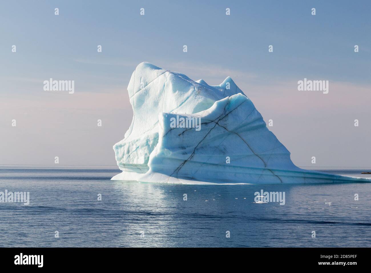 Iceberg floating in sea Stock Photo - Alamy