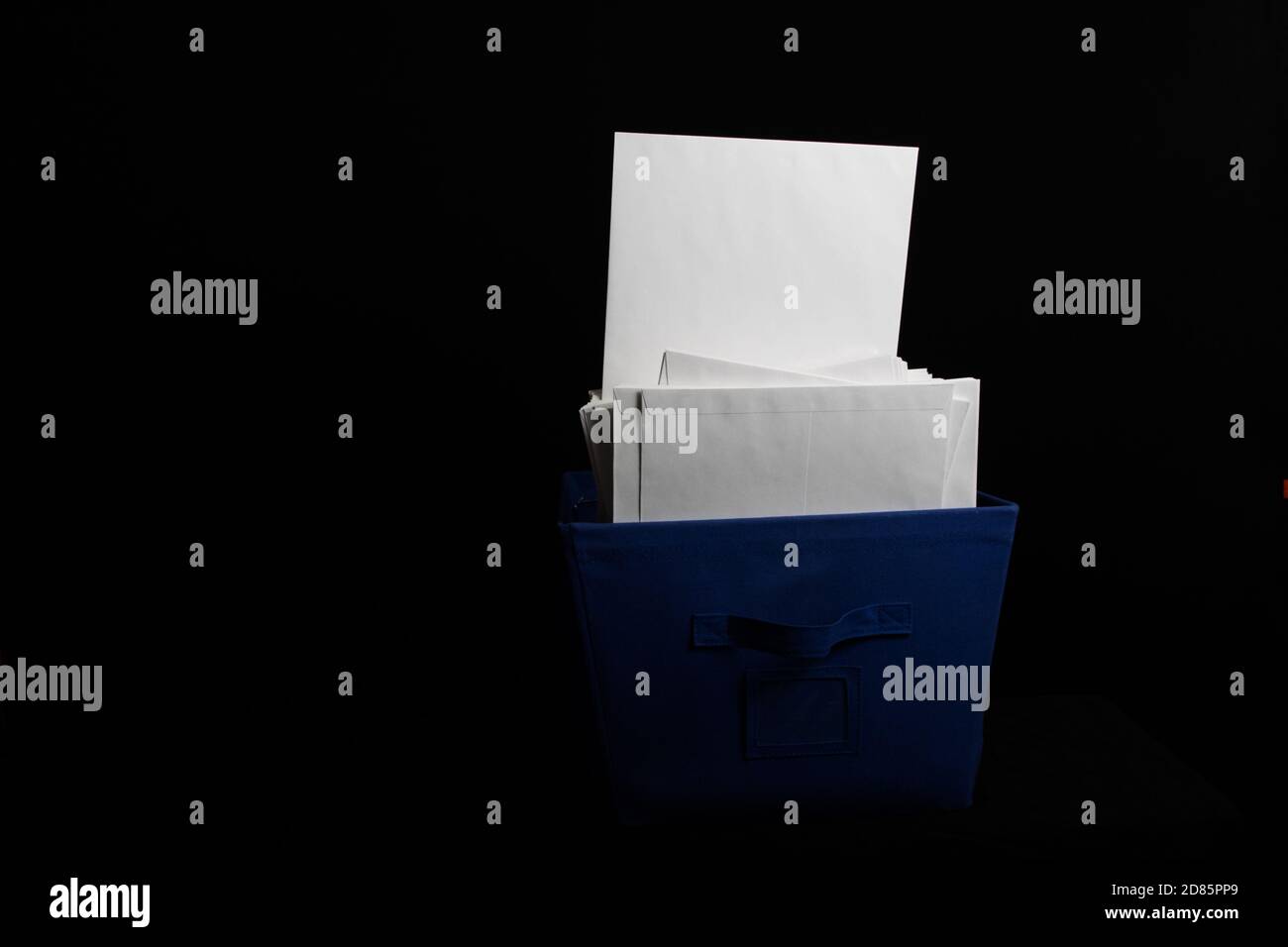 White envelopes in blue bin Stock Photo - Alamy