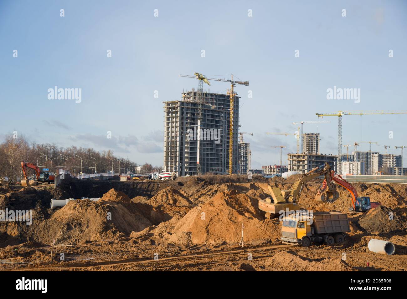 Excavator at a construction site on a background of a construction ...
