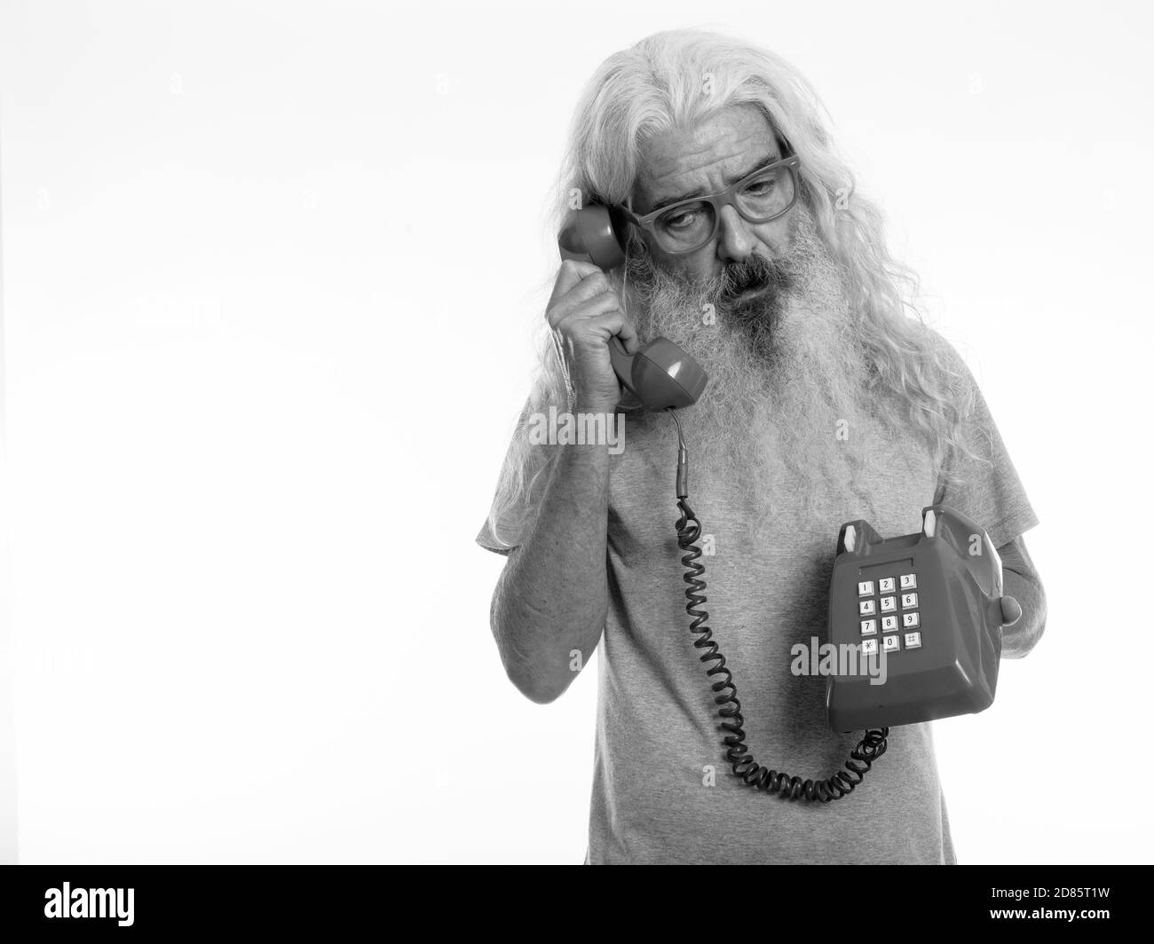 Elderly man talking telephone worried hi-res stock photography and ...