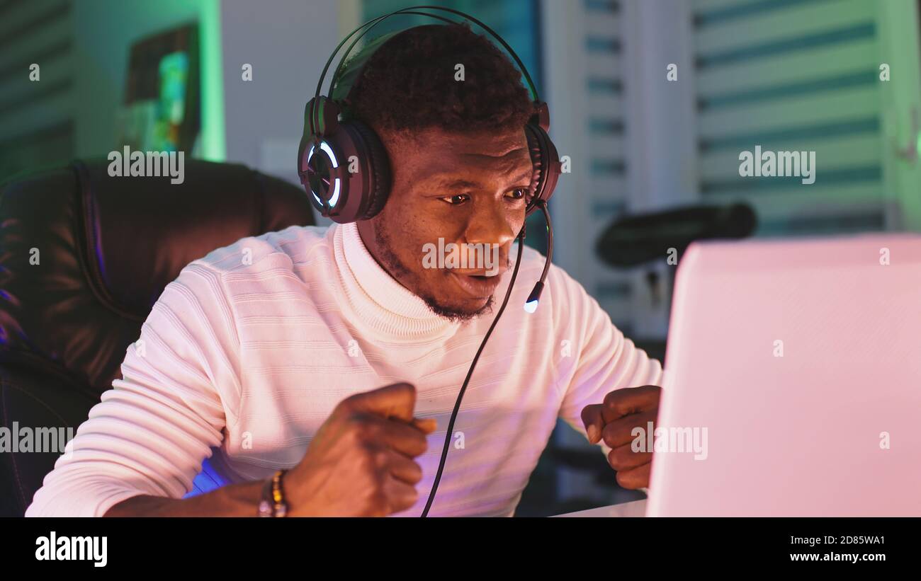 Portrait shot of disappointed young black man professional game player ...