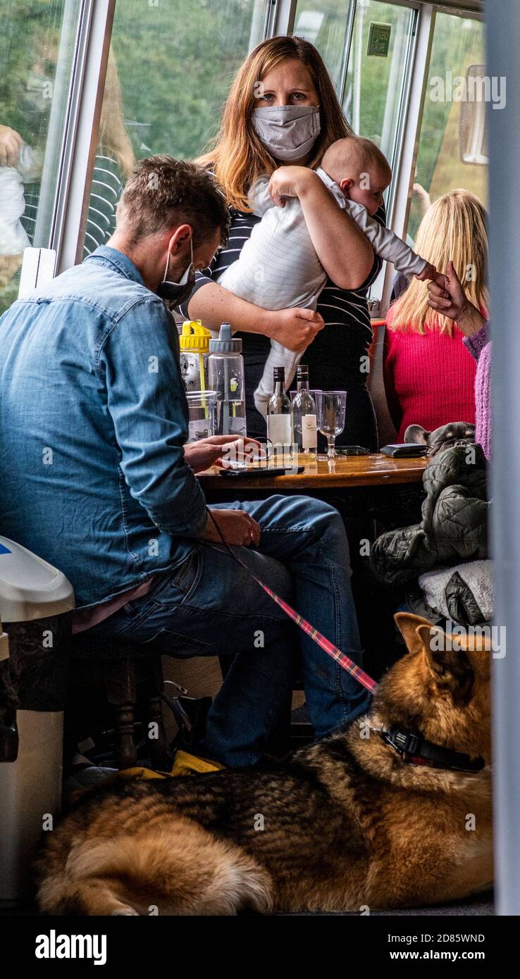 Family in pub with dogs and baby, Wroxham, Norfolk, England, UK Stock ...