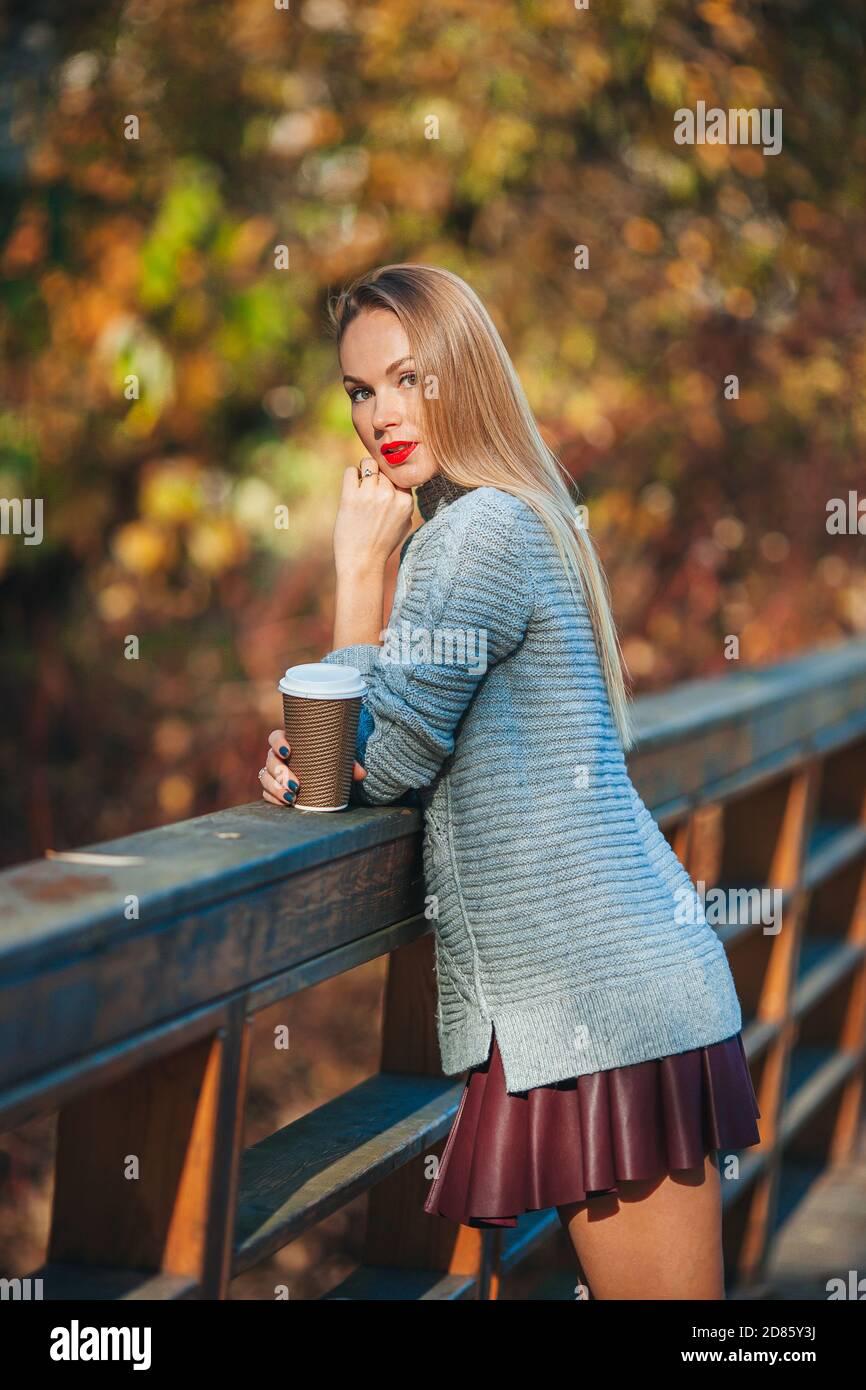 Fall concept - beautiful woman in autumn park under fall foliage Stock ...