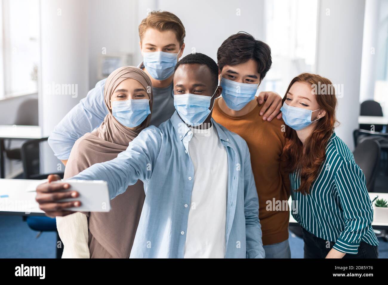 International students wearing medical masks taking selfie Stock Photo ...
