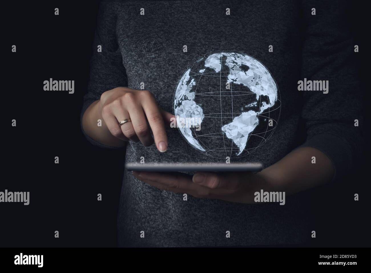 world map hologram and hand writing in laptop. Research and development ...