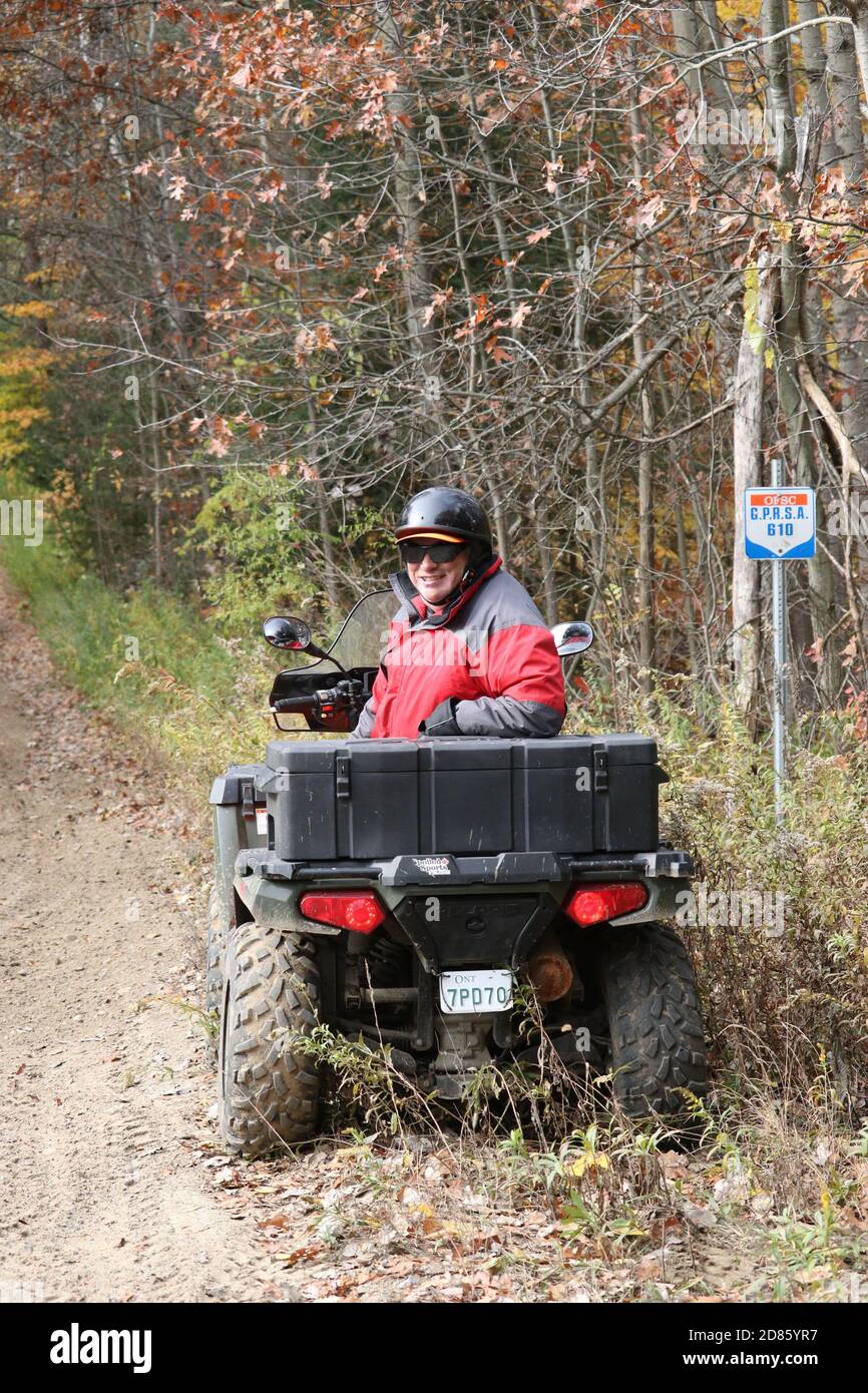 ATVing in the forest in fall Stock Photo - Alamy