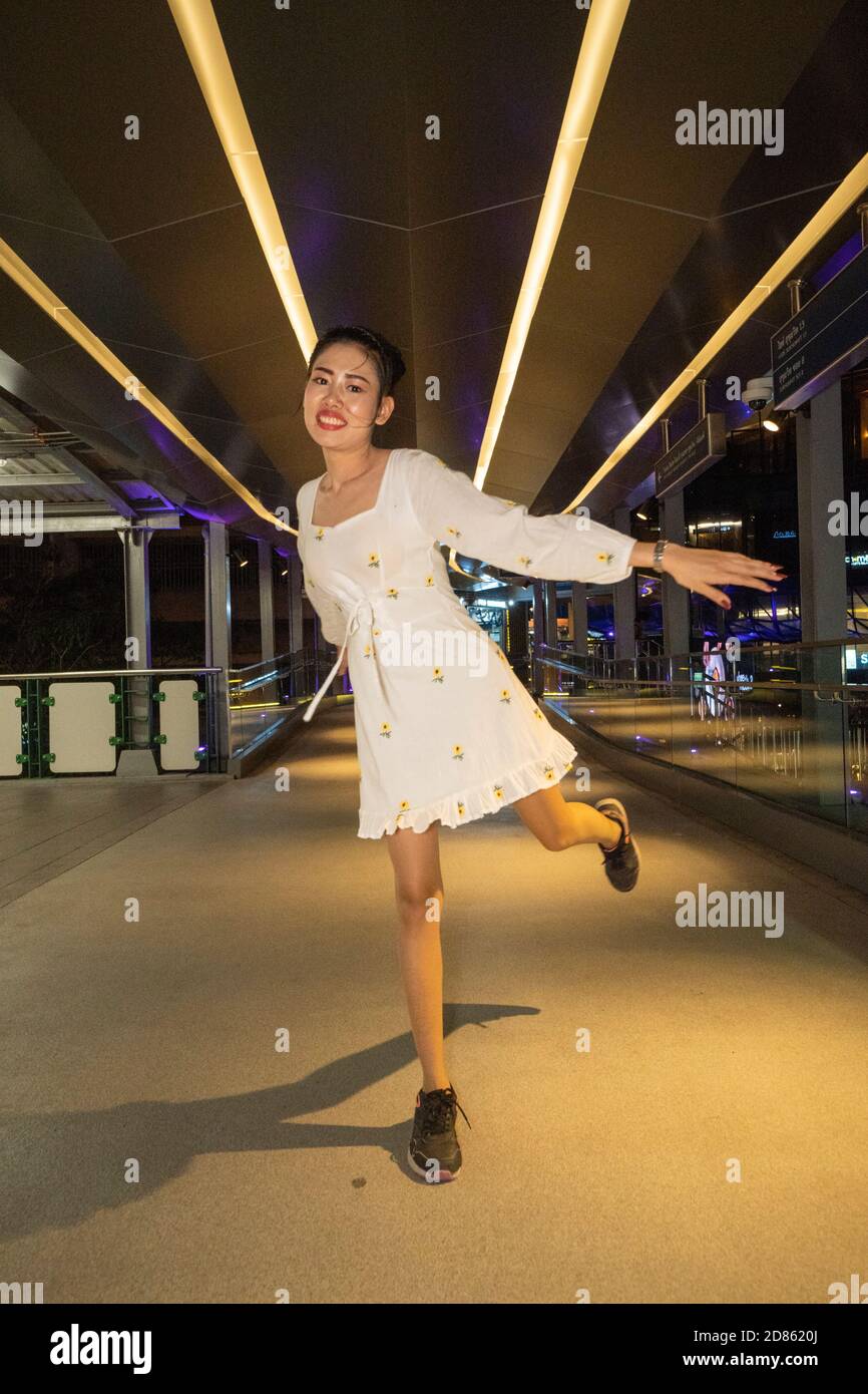 Young Asian girl in lights Stock Photo - Alamy