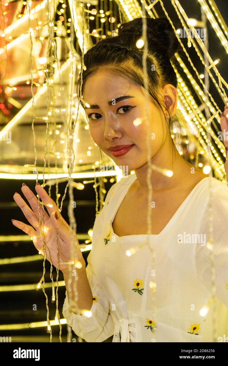 Young Asian girl in lights Stock Photo - Alamy