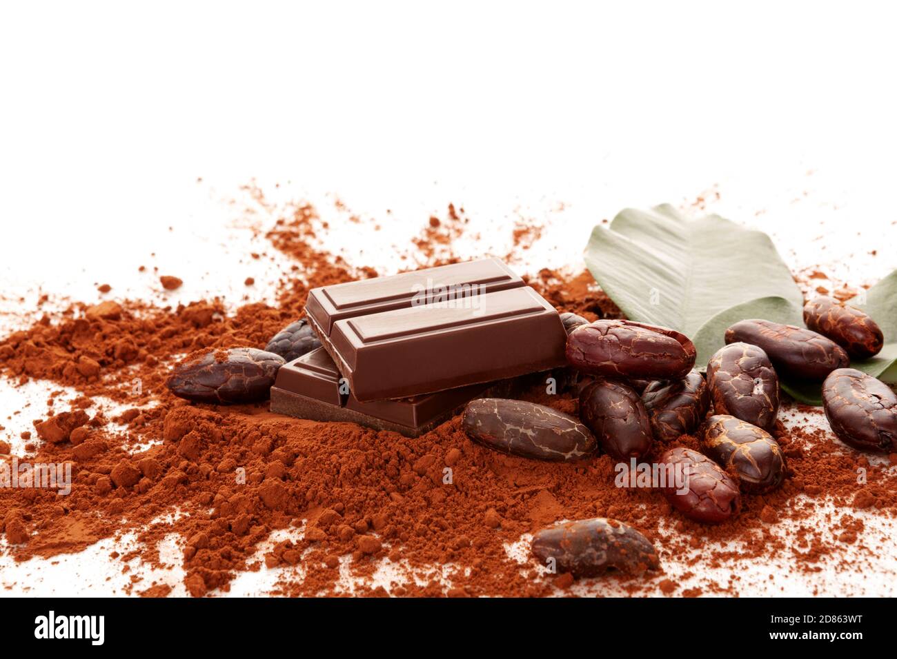 Composition with cocoa powder, beans, chocolate and leaves on white ...