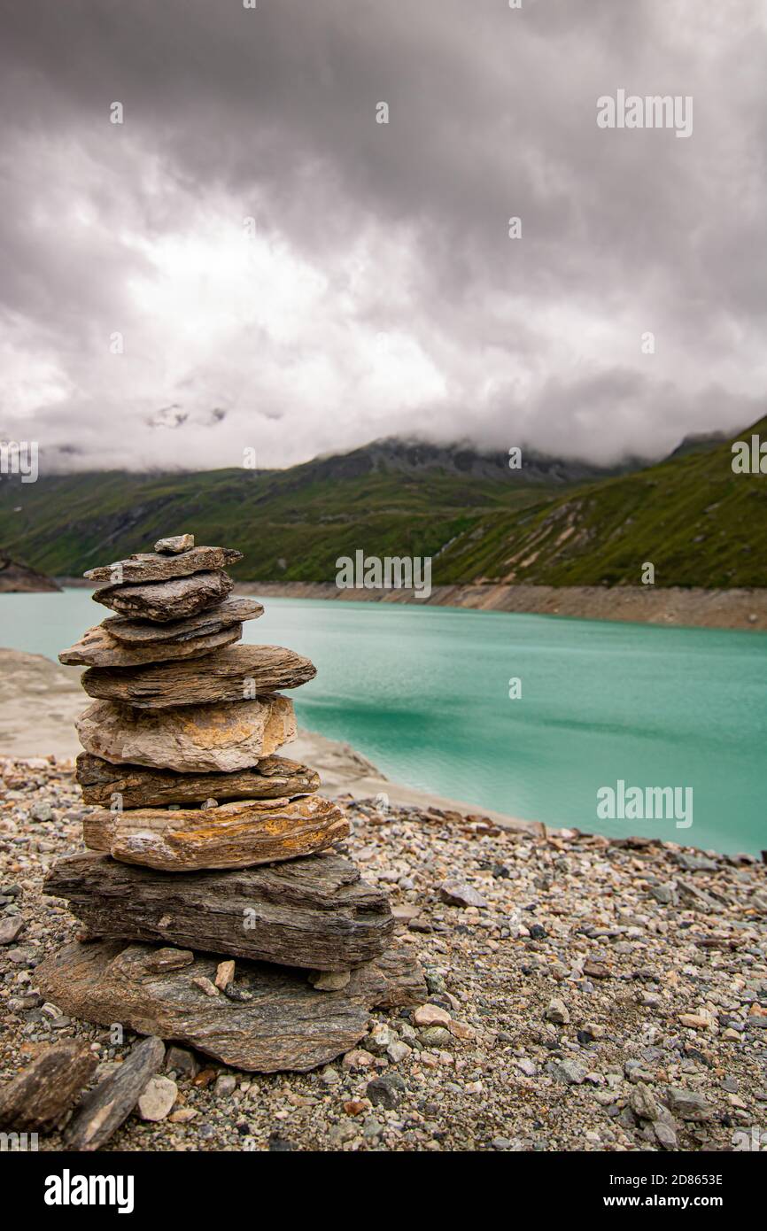 small zen stone tower in front of the clear lake Stock Photo - Alamy