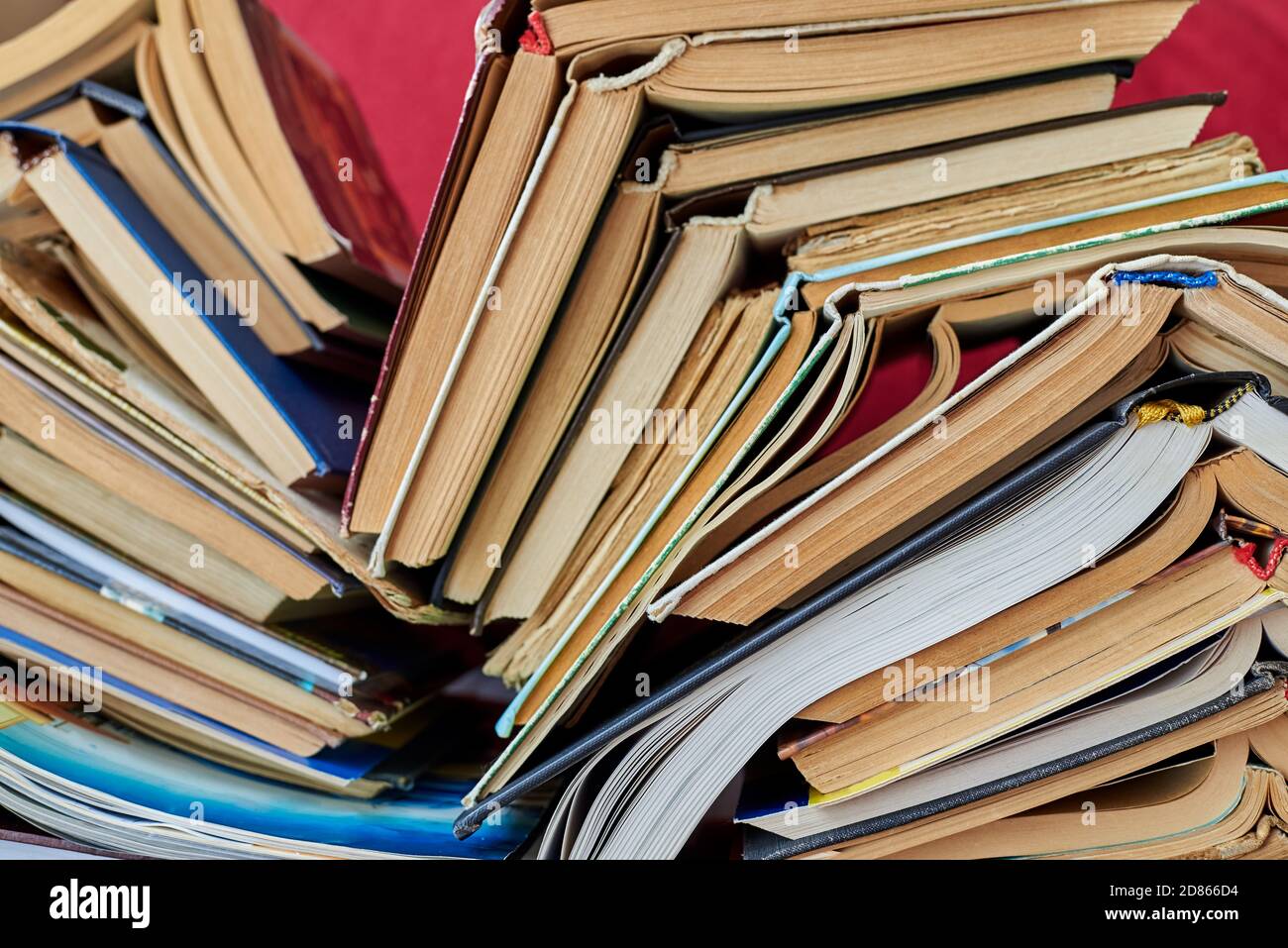 Old books piled up in a heap, close-up, learning and education concept ...