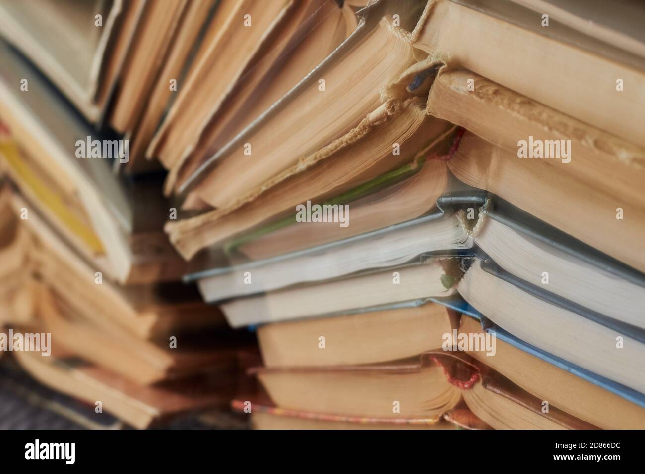 Old books piled up in a heap with special effect, close-up, learning ...