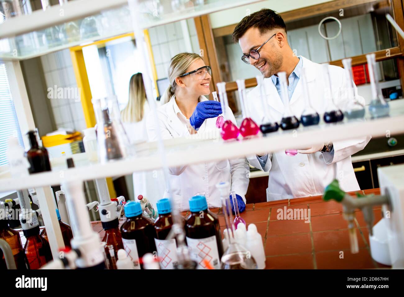 Young researchers analyzing chemical data in the laboratory Stock Photo ...