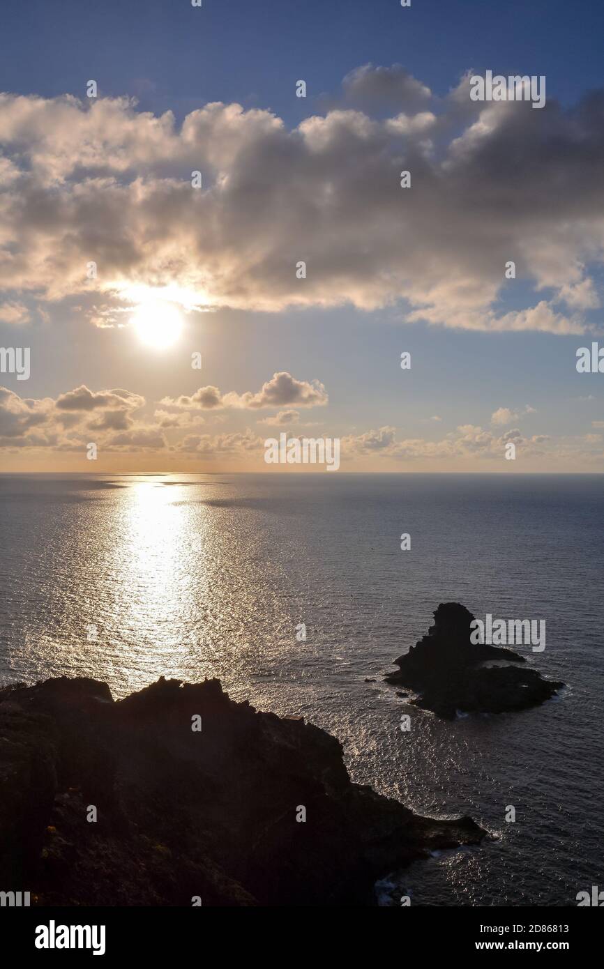 The Sun Setting in the Sea Stock Photo - Alamy