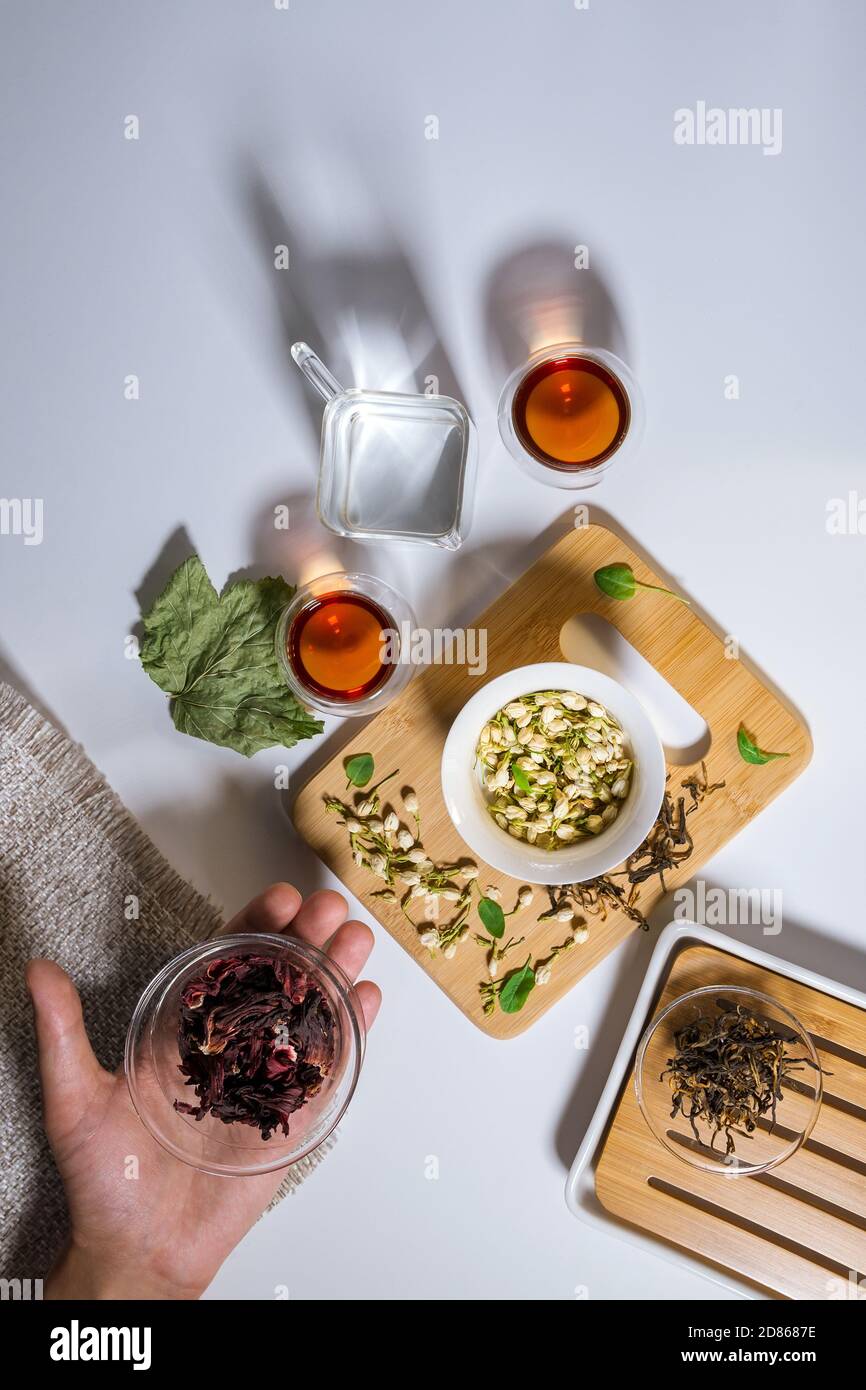 Chinese tea party. Dry granules of different types of tea. Flatlay, top ...