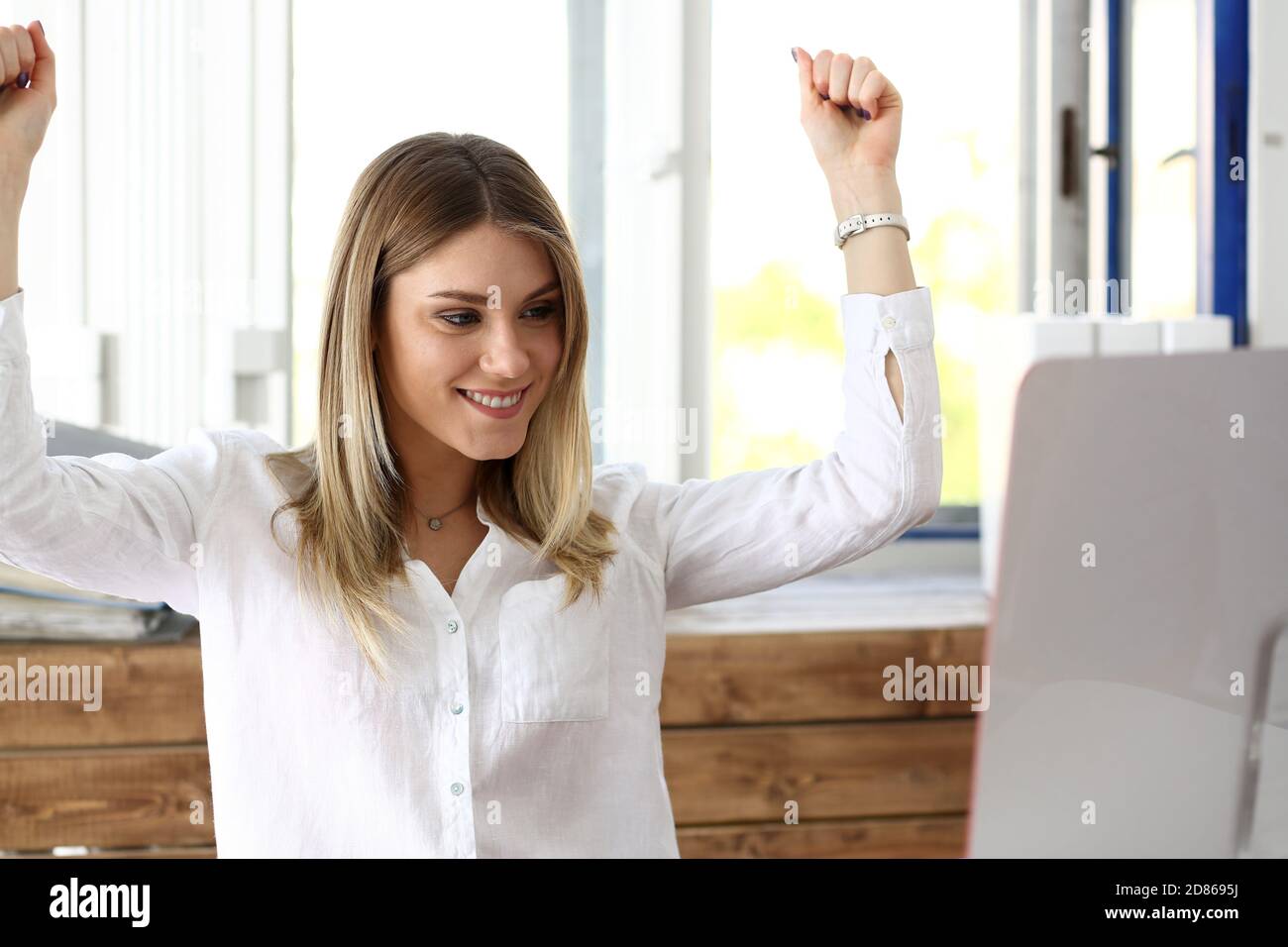 Beautiful joyful woman at workplace using computer pc Stock Photo - Alamy