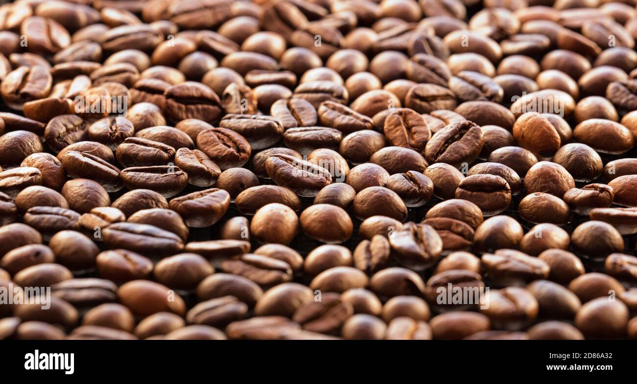 Broken coffee beans, background of roasting coffee beans Stock Photo ...