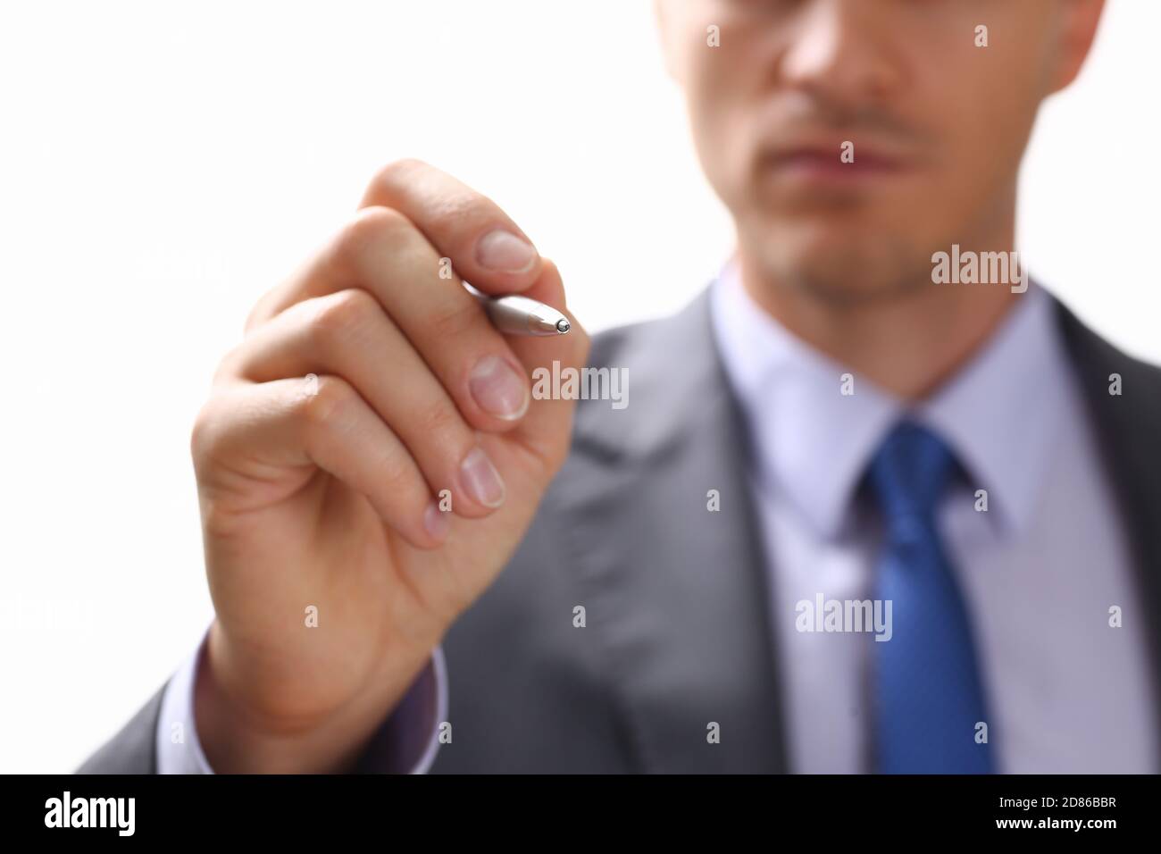 Male arm in suit and tie fill form clipped to pad Stock Photo - Alamy