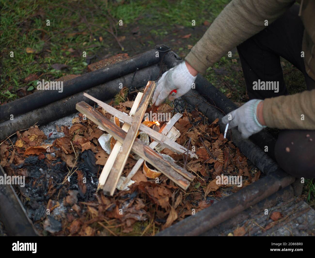 Man starting a campfire hi-res stock photography and images - Alamy