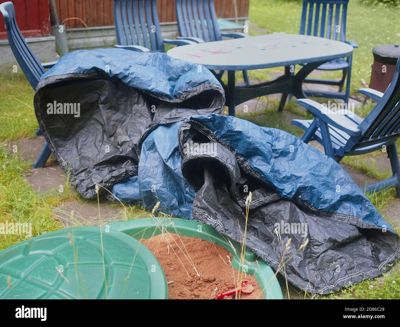 A backyard in mess after a wind blow, outdoor shot Stock Photo - Alamy