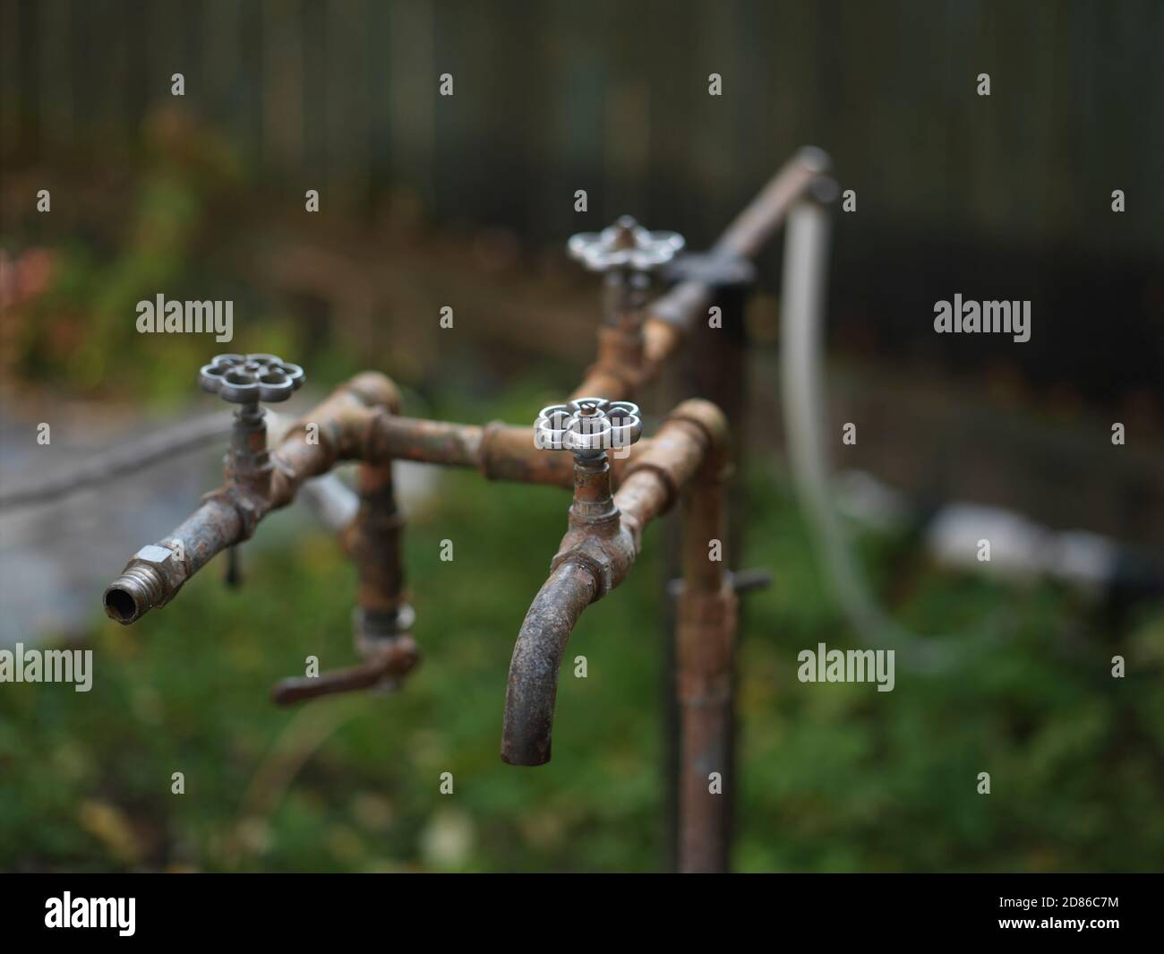 Old metal rusty water supply pipes and taps, shallow dof Stock Photo ...