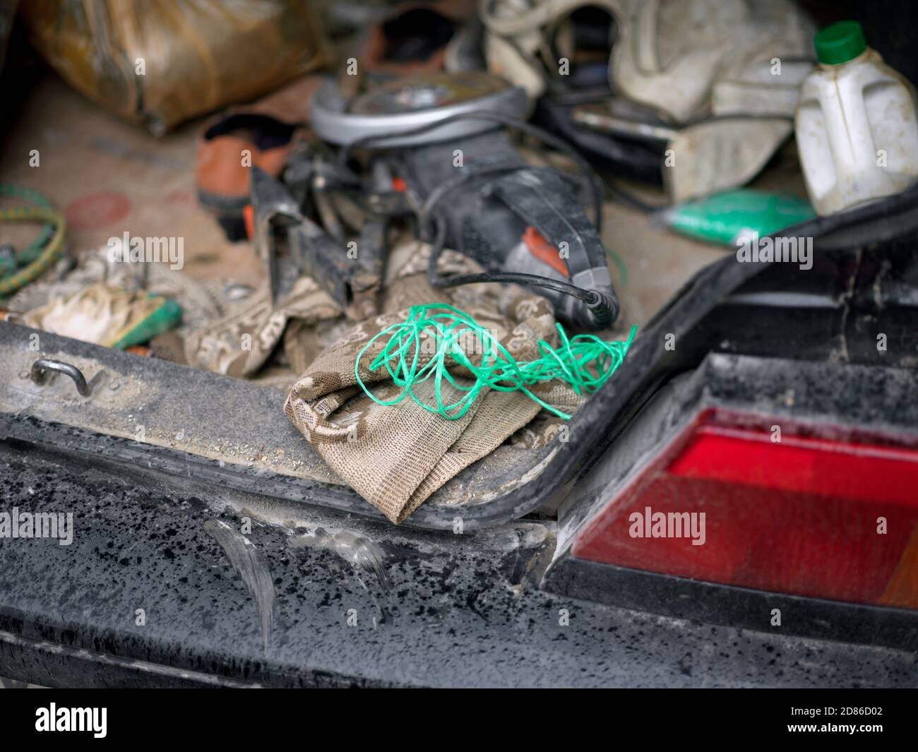Open messy car trunk with handtools, outdoor closeup Stock Photo - Alamy