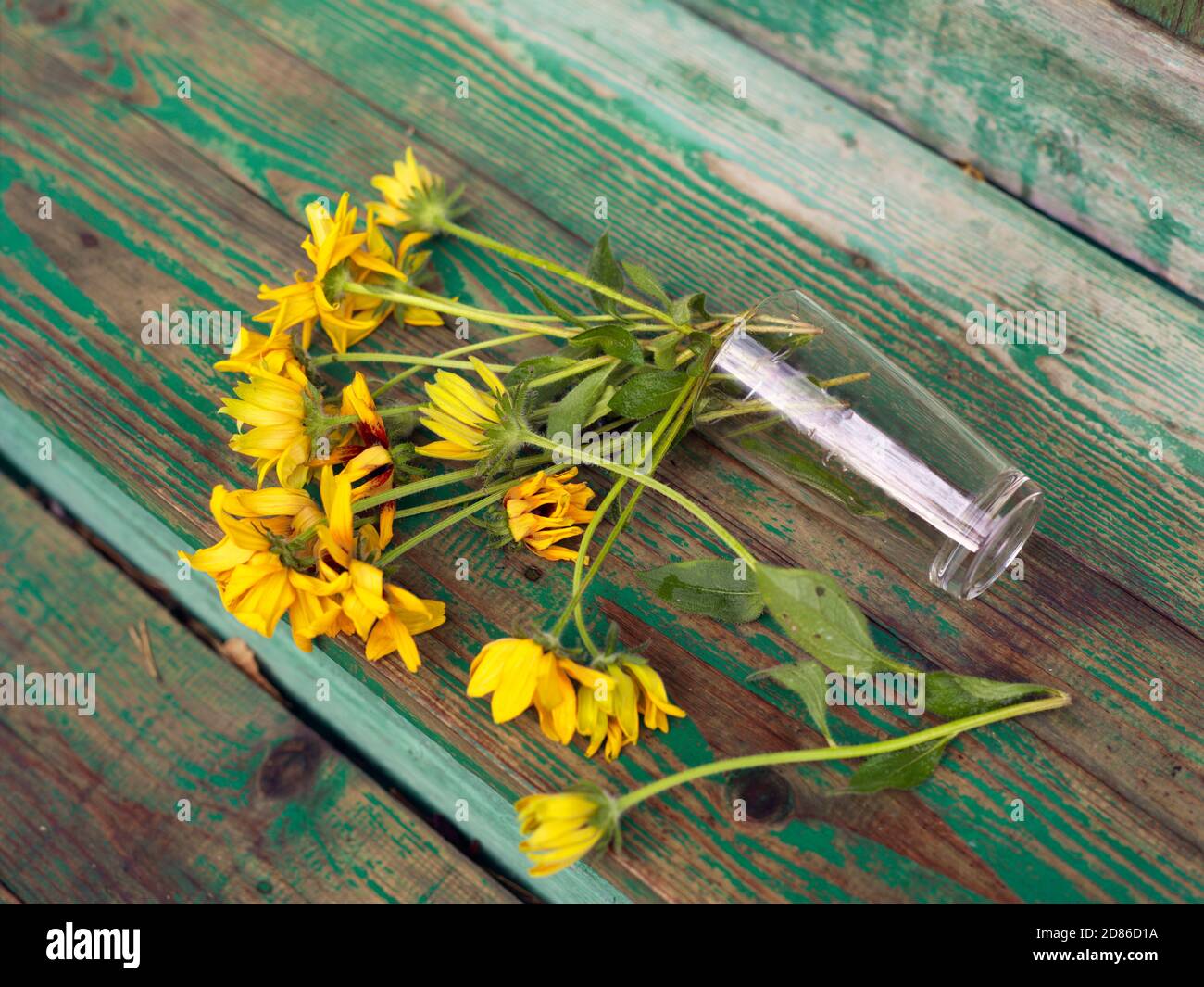 turned over bouquet, abandoned on the wooden steps Stock Photo - Alamy