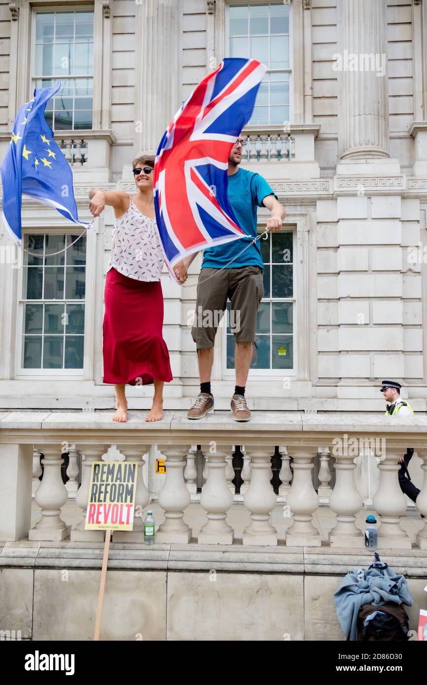 London, United Kingdom, August 31st 2019:- A man and a woman wave ...