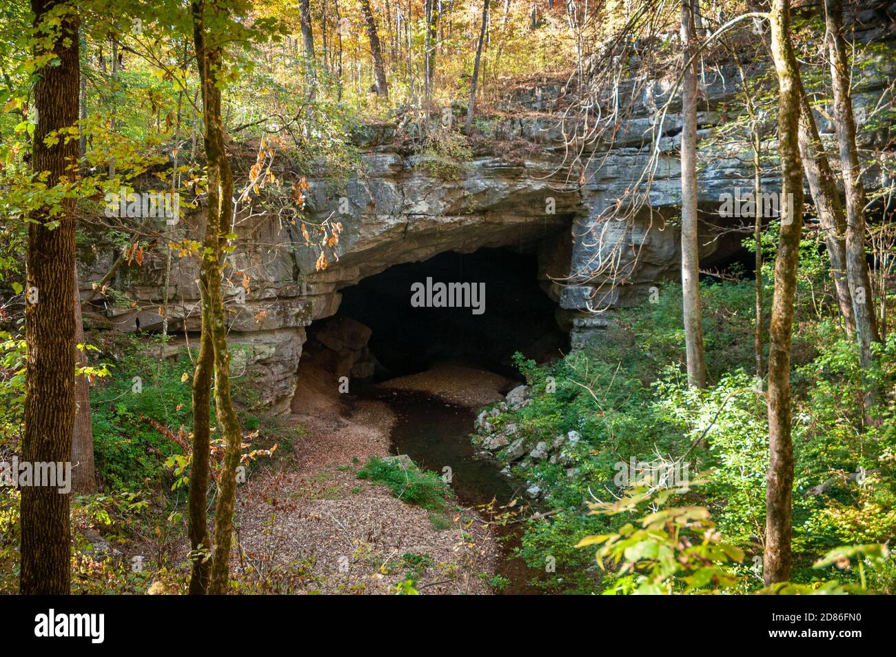 A small stream coming from inside a cave at Russell Cave National ...